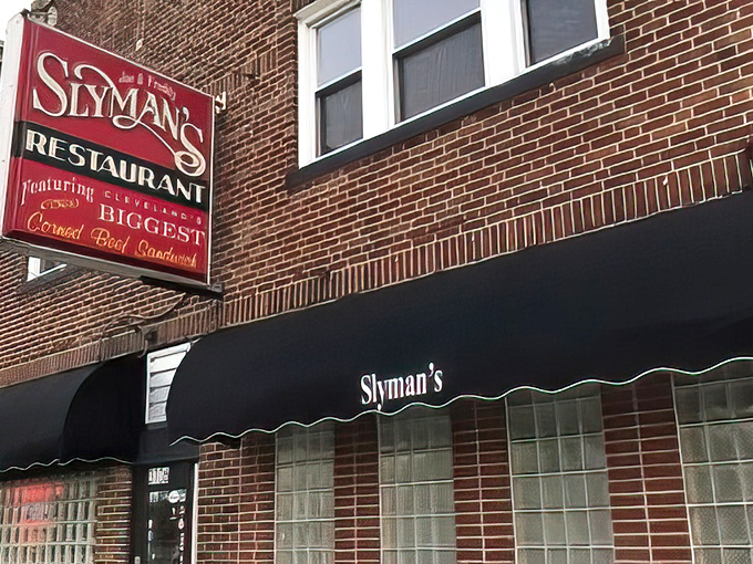 The iconic red sign beckons like a lighthouse for sandwich lovers, promising Cleveland's biggest corned beef creation behind those brick walls.
