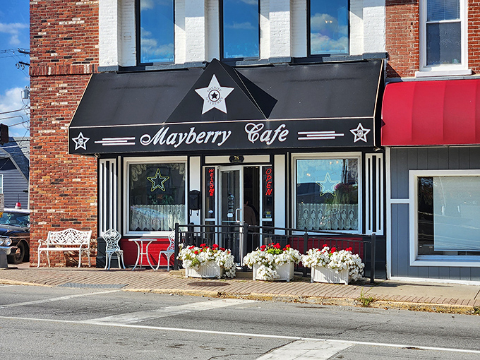 The iconic black awning with sheriff's stars announces your arrival at Mayberry Cafe, where nostalgia is always the first course on the menu.