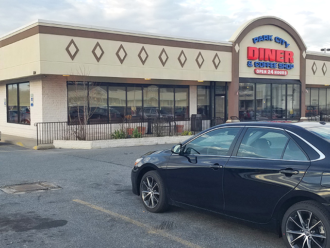 The neon-bright sign of Park City Diner stands like a lighthouse for hungry travelers, promising 24-hour comfort in Lancaster's sea of dining options.
