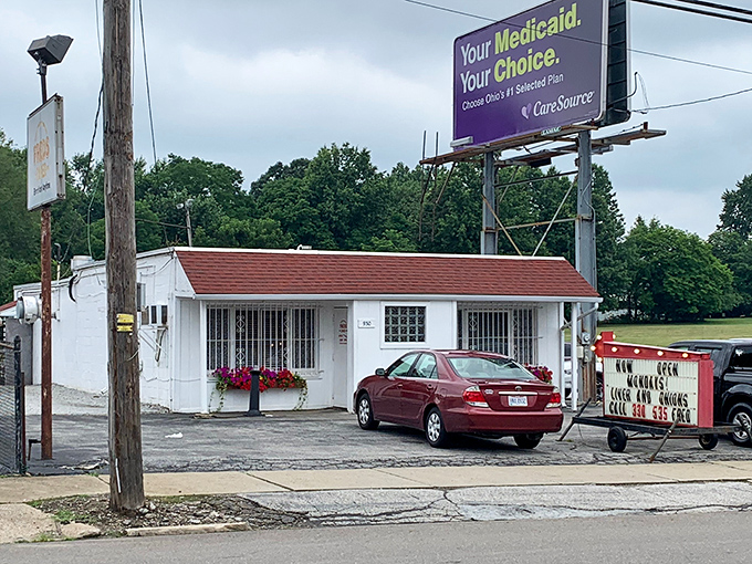 Fred's Diner stands like a humble white sentinel on Akron's East Avenue, its unassuming exterior hiding culinary treasures that locals have cherished for decades.