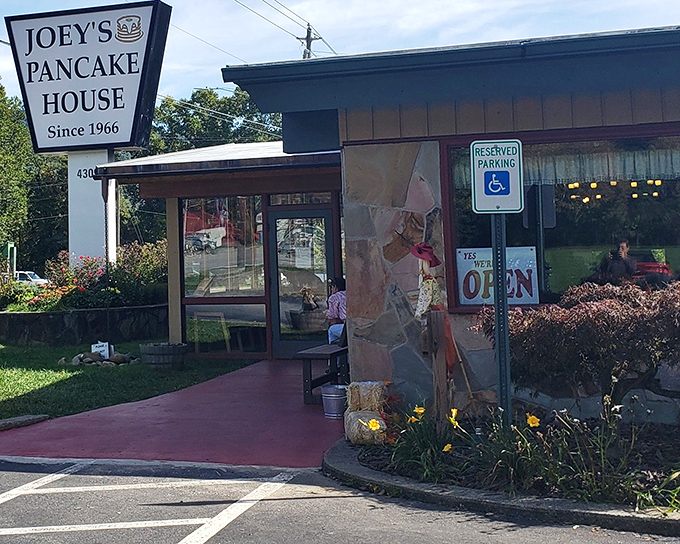 The humble roadside sign promises pancakes, but what awaits inside is nothing short of breakfast nirvana nestled in the misty Smoky Mountains.