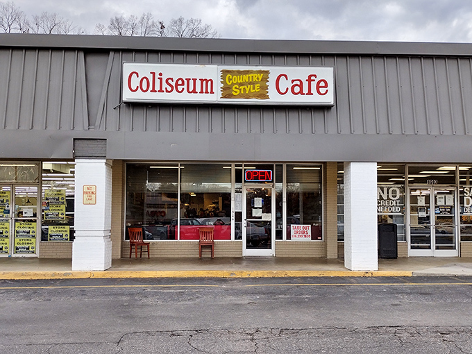 The unassuming storefront might not stop traffic, but locals know this gray strip mall hides culinary gold. Two red chairs stand sentinel, like they're saving you a spot.