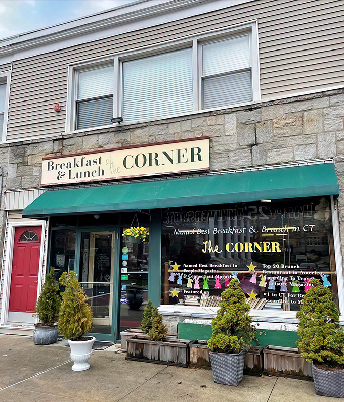 Stone facade meets green awning in a combination that whispers "breakfast" louder than any neon sign ever could.