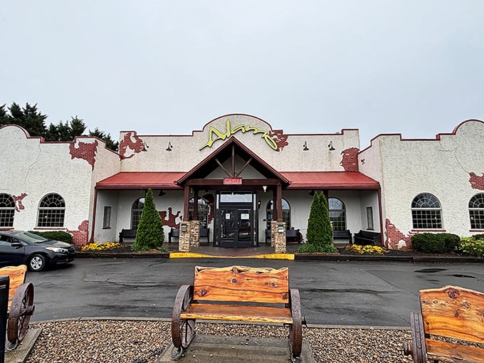 The Alamo's distinctive white stucco exterior and red roof stand as a beacon for carnivores amid Pigeon Forge's tourist attractions, promising Southwestern flair in the Smokies.