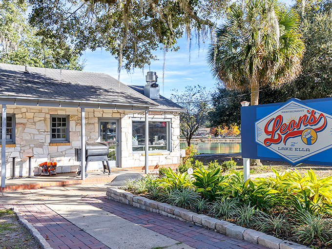 Leon's charming stone cottage exterior beckons like a culinary lighthouse on Lake Ella's shore, promising delicious treasures within its weathered walls.