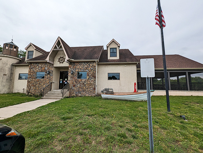 The stone facade and lighthouse-inspired tower of Kathy's Crab House stand as a nautical beacon for seafood lovers in Delaware City.