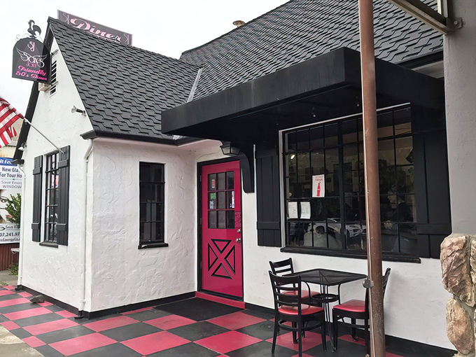 The pink door says it all: Sax's Joint welcomes you with retro charm and a promise of comfort food that delivers.