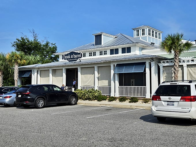 The coastal charm of Hook & Barrel beckons from the roadside, its metal roof and white exterior promising seafood salvation after a day at the beach.