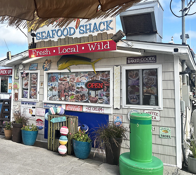 The weathered sign promises "Fresh &bull; Local &bull; Wild" &ndash; three words that perfectly sum up the coastal Carolina experience waiting inside this unassuming seafood haven.