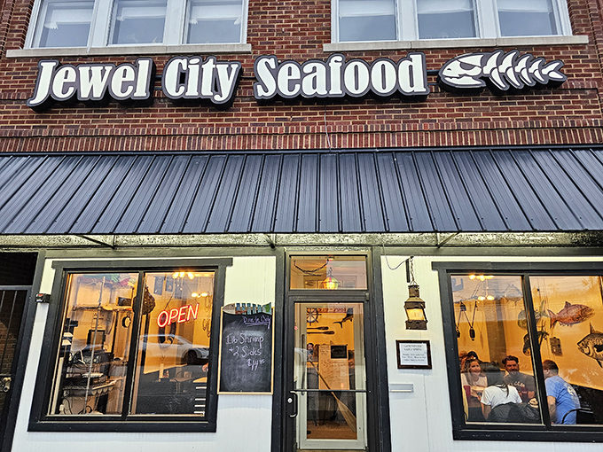 Brick exterior by day reveals the unassuming home of seafood excellence. The fish skeleton logo hints at the delicious fate awaiting everything that swims.