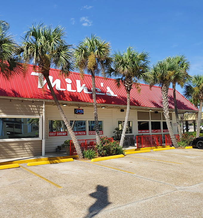 That classic red roof against the Florida sky is like a beacon for seafood lovers&mdash;palm trees standing guard over what locals know is culinary treasure.