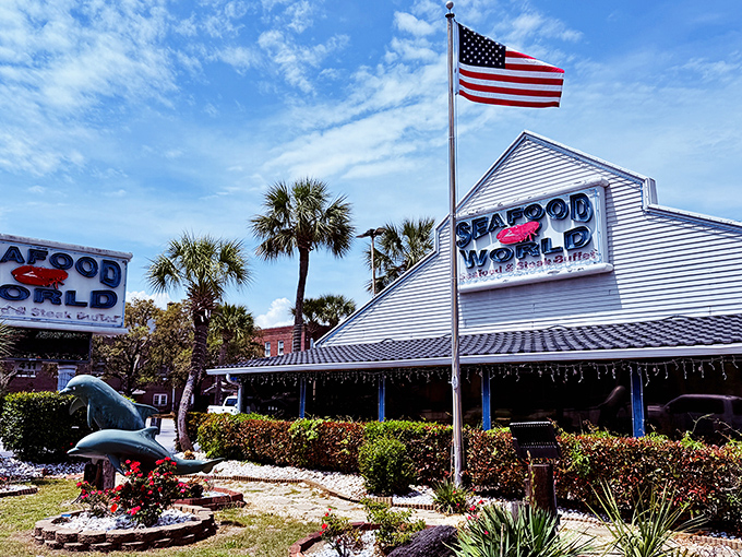 The American flag stands tall beside this coastal treasure, where patriotism and perfectly steamed crabs form an alliance your taste buds will salute.