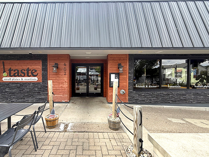 The coral-hued exterior of Taste beckons like a culinary lighthouse on South Haven's shore, promising small plates and big flavors behind its unassuming facade.