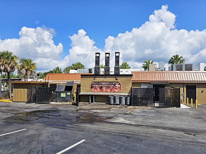 The unassuming exterior of Texas Cattle Company stands like a carnivore's oasis amid Lakeland's palm trees, promising meaty delights behind its rustic wooden fa&ccedil;ade.