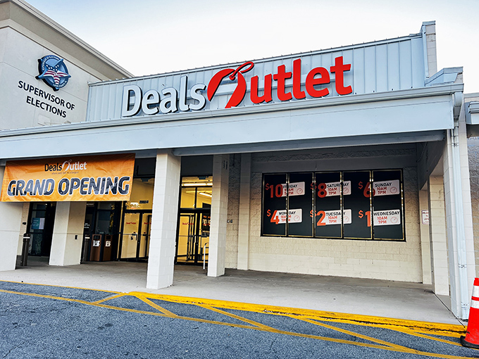 The bright red Deals Outlet sign beckons like a retail lighthouse, promising treasure hunts where your wallet won't walk the plank.