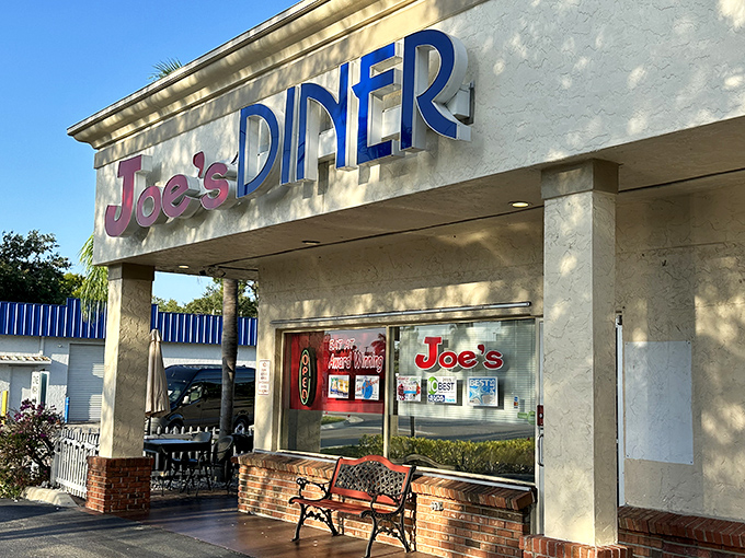 The iconic red and blue sign of Joe's Diner welcomes hungry patrons like a beacon of breakfast hope on Tamiami Trail.