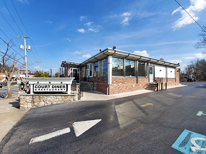 The classic stone and brick exterior of Court Diner stands like a beacon of breakfast hope in Media, Pennsylvania. American flag included, no extra charge.