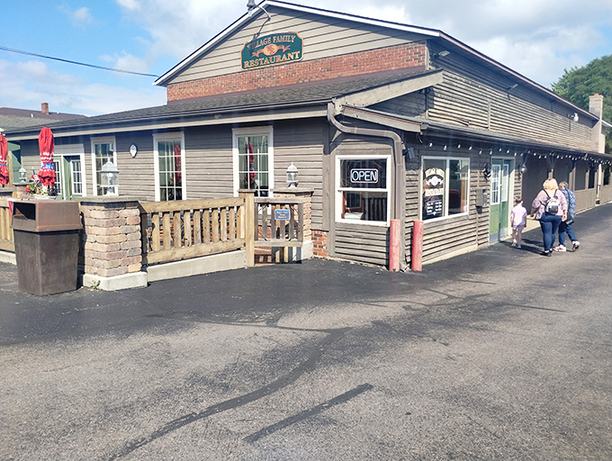 The classic roadside profile of Village Family Restaurant stands as a beacon to travelers seeking authentic local flavor rather than cookie-cutter chain experiences.