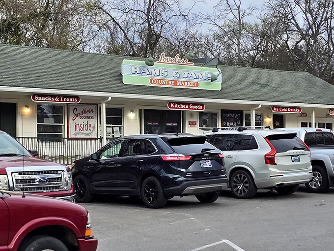 The Hams & Jams Country Market sign has guided hungry travelers to biscuit nirvana for generations, standing tall against the Tennessee sky.