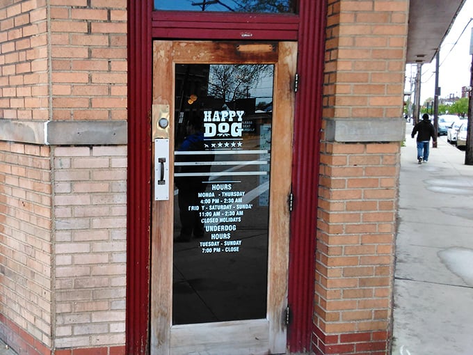 The unassuming brick exterior of Happy Dog hides a culinary playground within. Cleveland's hot dog heaven announces itself with a cheerful vintage sign.