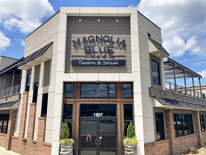 The modern facade of Magnolia Blue welcomes you with warm wooden doors and lush greenery &ndash; like finding a secret clubhouse where the password is "delicious."