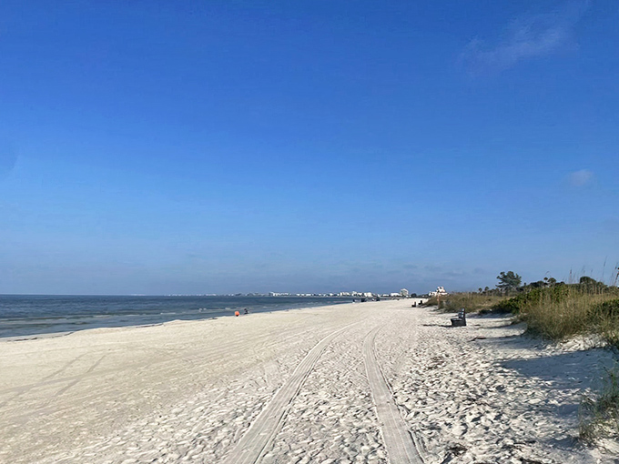 Miles of pristine shoreline stretch before you at Pass-a-Grille Beach, where tire tracks in the sand are the only evidence of civilization.