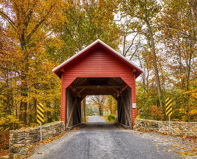 Like autumn decided to throw a party and invited this charming red bridge as the guest of honor. Nature's perfect frame for Maryland's smallest covered bridge.