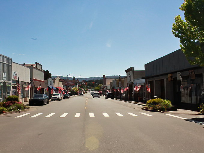 Main Street Fortuna, where American flags flutter proudly and mountains provide a backdrop worthy of a Norman Rockwell painting.
