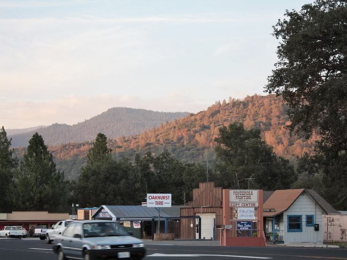 Sunset paints the Sierra foothills in golden hues as Oakhurst nestles between mountains, offering a glimpse of California living that won't bankrupt your retirement fund.