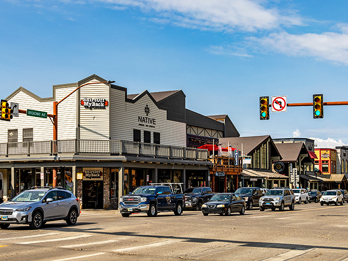 Western storefronts line the streets where cowboy culture meets mountain sophistication in perfect harmony.