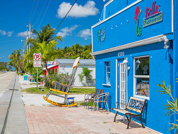 Bella's Restaurant's brilliant blue facade and vintage rocking chair invite you to slow down&mdash;this is Old Florida's version of a LinkedIn notification.