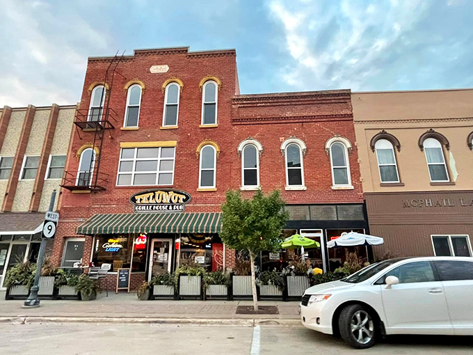 Teluwut Grille & Pub anchors Main Street with classic brick architecture that whispers "come in, stay awhile" &ndash; small-town charm with big-time hospitality.