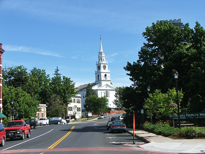 Middlebury's iconic white church spire reaches skyward like Vermont's own exclamation point, announcing "Yes, this town really is this charming!"
