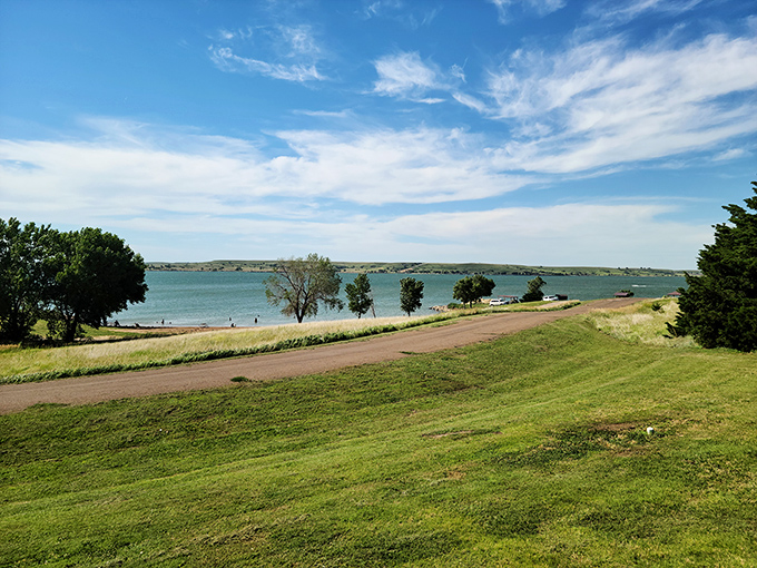 Wilson Lake's crystal-clear waters meet endless Kansas sky, creating the perfect backdrop for your stress-free escape from reality.