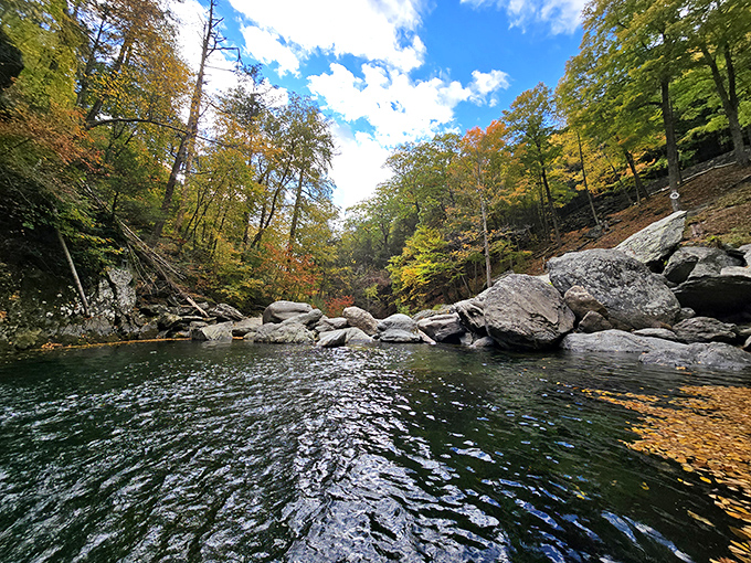 Nature's own infinity pool. The emerald waters of Bash Bish reflect autumn's golden touch, creating a tranquil sanctuary that rivals any luxury resort.