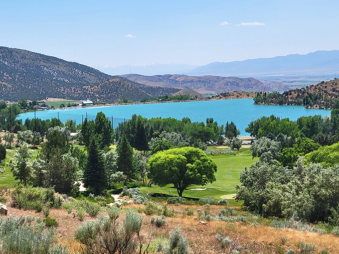 Mother Nature showing off again with that impossible turquoise water against Utah's desert palette. Someone clearly cranked up the saturation on reality here.