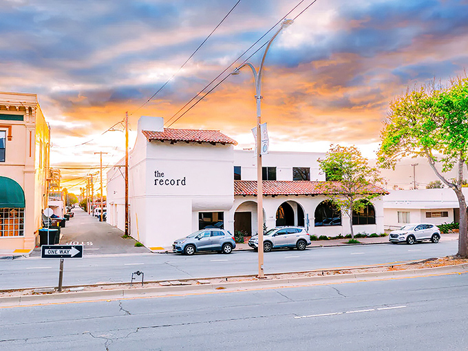 The Record building stands as a sentinel of small-town charm, its white walls glowing amber in a California sunset that doesn't charge admission.
