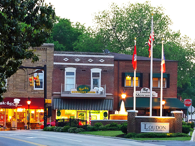 Loudon's historic district glows at dusk, where brick buildings and American flags create that perfect small-town tableau Norman Rockwell would've loved.