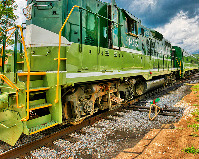 Engine #4465 gleams in its distinctive green livery, a mechanical time capsule waiting to whisk passengers through Indiana's hidden landscapes.