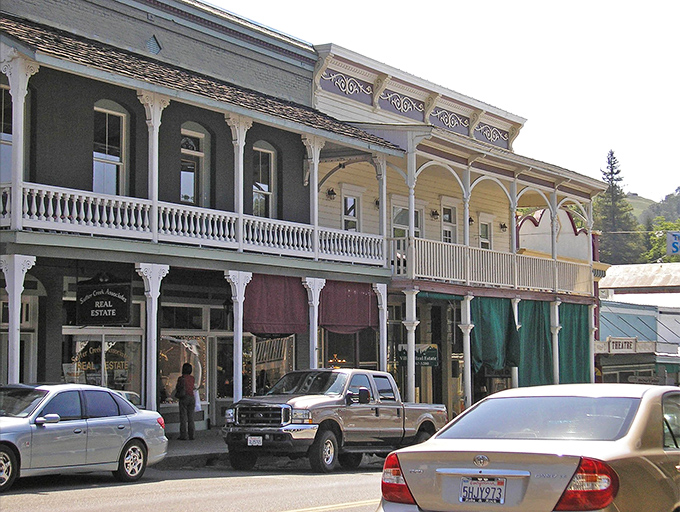 Victorian elegance meets Wild West charm along Sutter Creek's Main Street, where ornate balconies and colorful awnings transport visitors to California's golden era.