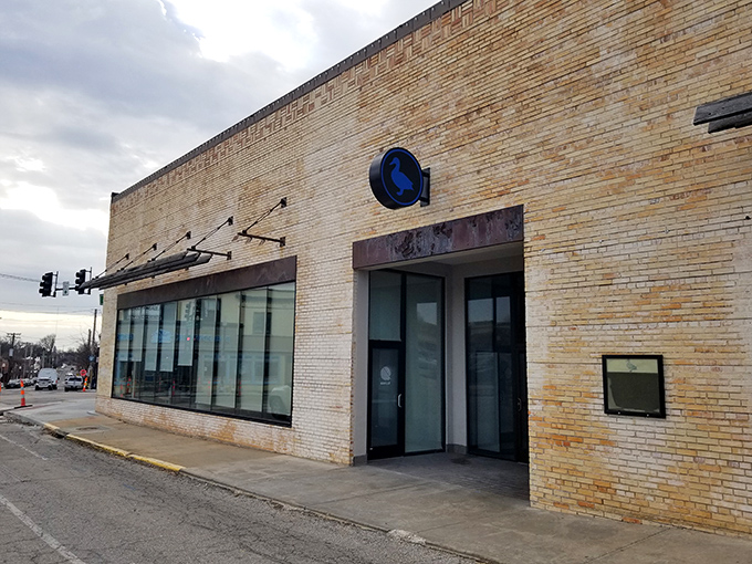 The unassuming brick exterior of The Blue Duck hides culinary treasures within, like a delicious secret waiting to be discovered.