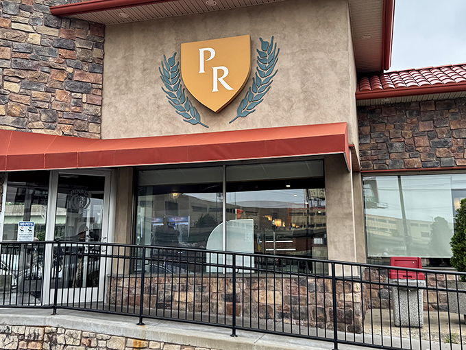 The golden PR shield announces you've arrived at diner royalty, where breakfast reigns supreme and calories don't count before noon.