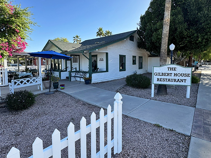 Home is where the hollandaise is! This charming white cottage with green trim promises breakfast magic behind its welcoming picket fence.