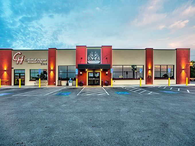The Colonial House's bold red columns and welcoming facade stand ready to rescue hungry travelers on Mount Rushmore Road. A beacon of breakfast brilliance awaits inside.
