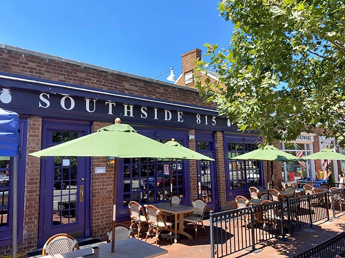 The purple-trimmed facade of Southside 815 stands out like a welcoming beacon, promising Southern comfort in Alexandria's historic streets.