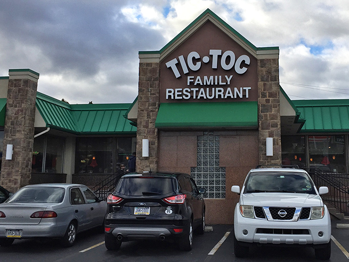The stone facade and signature green awnings of Tic-Toc stand like a beacon for breakfast pilgrims. This unassuming exterior houses culinary treasures worth every mile of your journey.