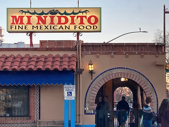 The iconic Mi Nidito sign beckons hungry travelers like a lighthouse for the stomach-starved. This South Tucson landmark promises Mexican cuisine worth the inevitable wait.