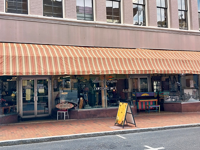 The classic striped awning beckons like a vintage carnival barker: "Step right up, folks! History and treasures await inside!"