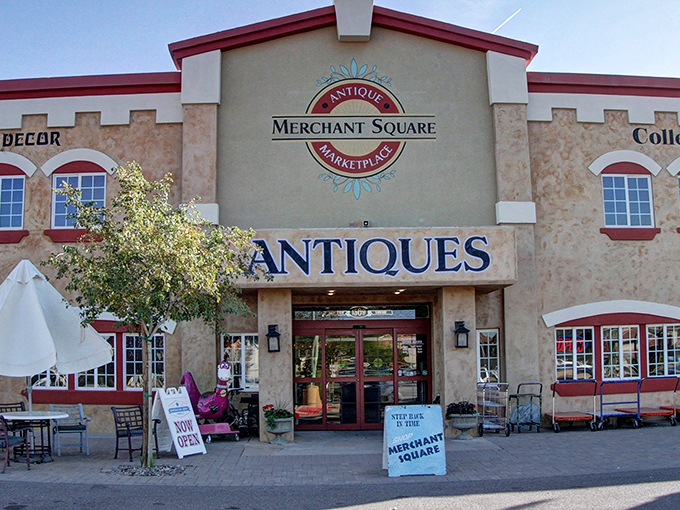 The castle-like exterior of Merchant Square beckons treasure hunters with its distinctive cream walls and red accents, promising adventures in antiquing.