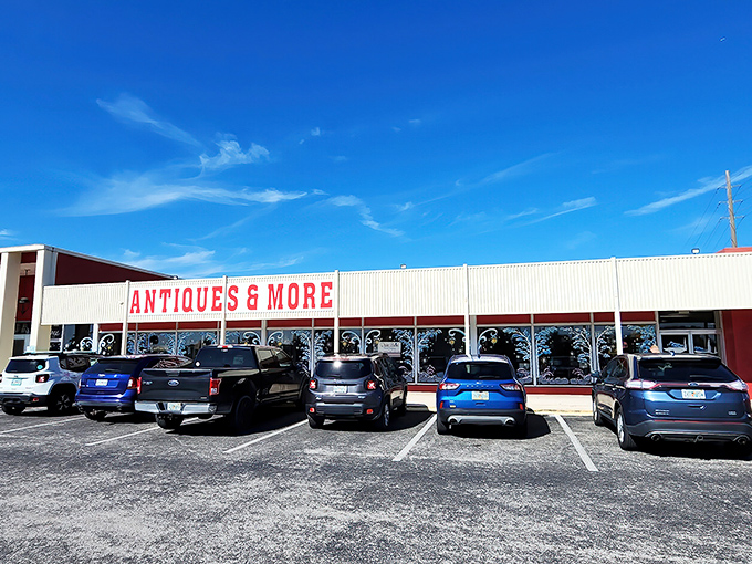 The unassuming exterior of Wildwood Antique Mall hides its treasures like a poker player with a royal flush. Florida sunshine bounces off the "ANTIQUES & MORE" sign, promising adventures within.